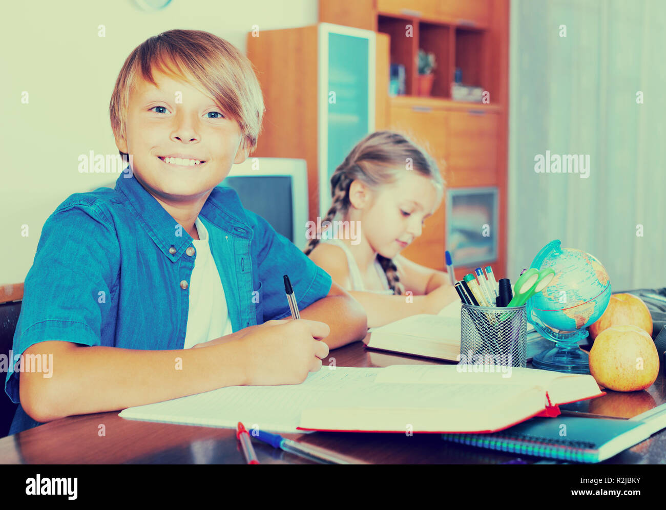 Teen brother reading books to young hi-res stock photography and images ...
