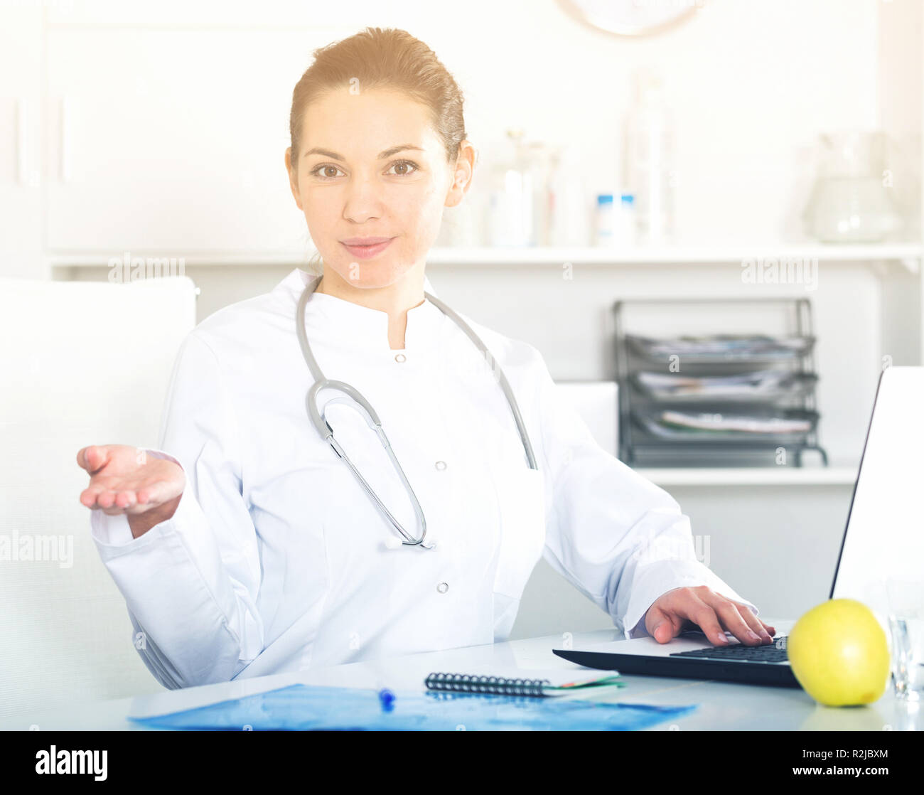 Young female doctor ready to receive clients in her office Stock Photo ...