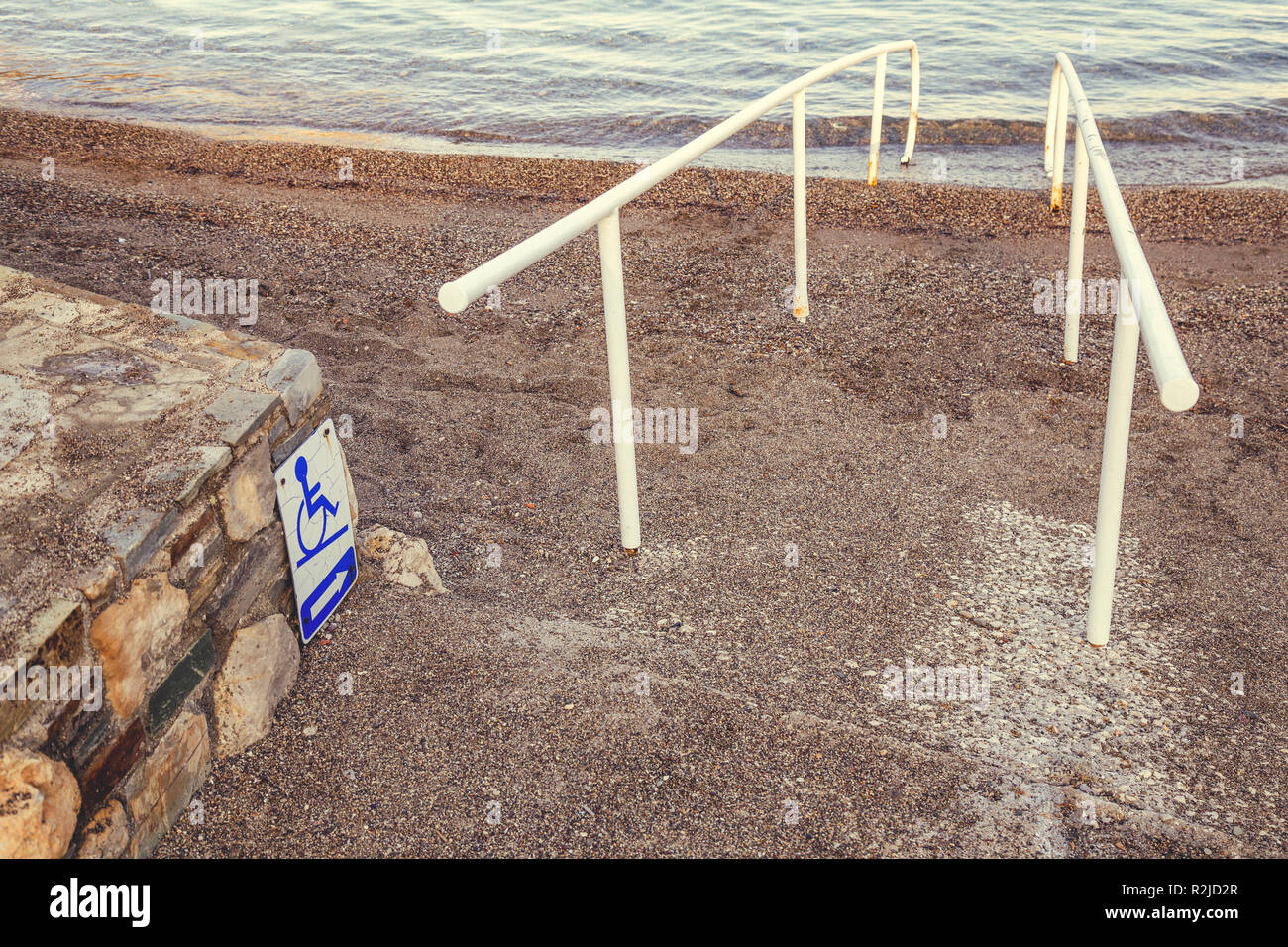 Beach access and sign for the disabled. Handicap access sign and sea ...