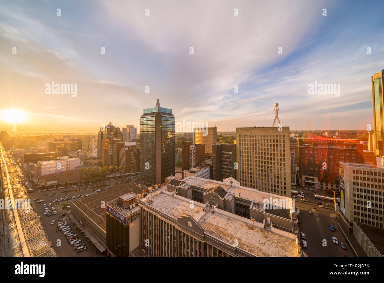 A sunset is seen over the Harare city skyline in Zimbabwe Stock Photo ...