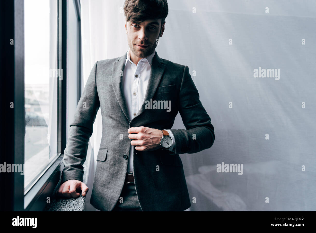 Adjusting jacket hi-res stock photography and images - Alamy