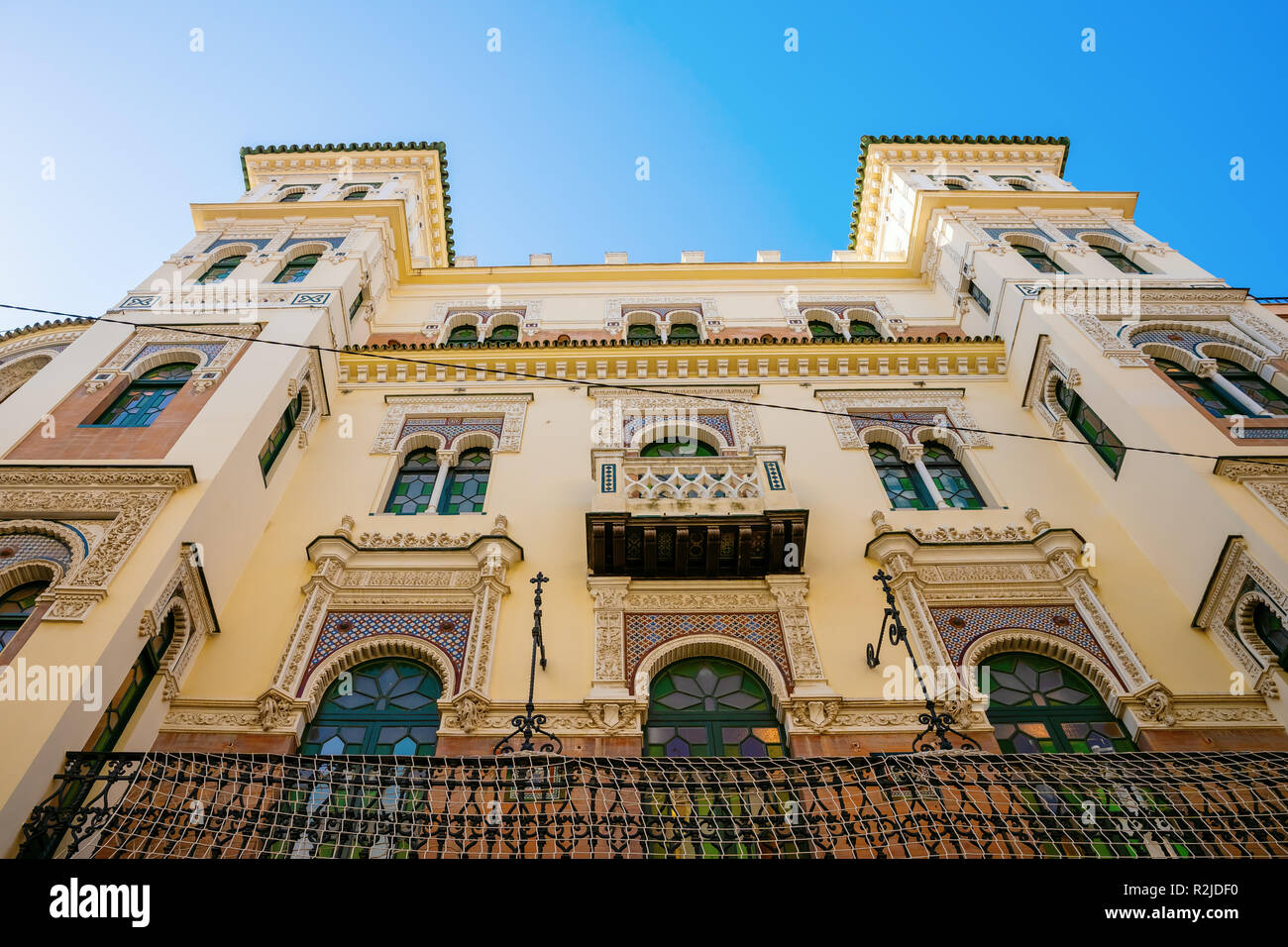 picture of the facade of an old, traditional building in Seville, Spain ...