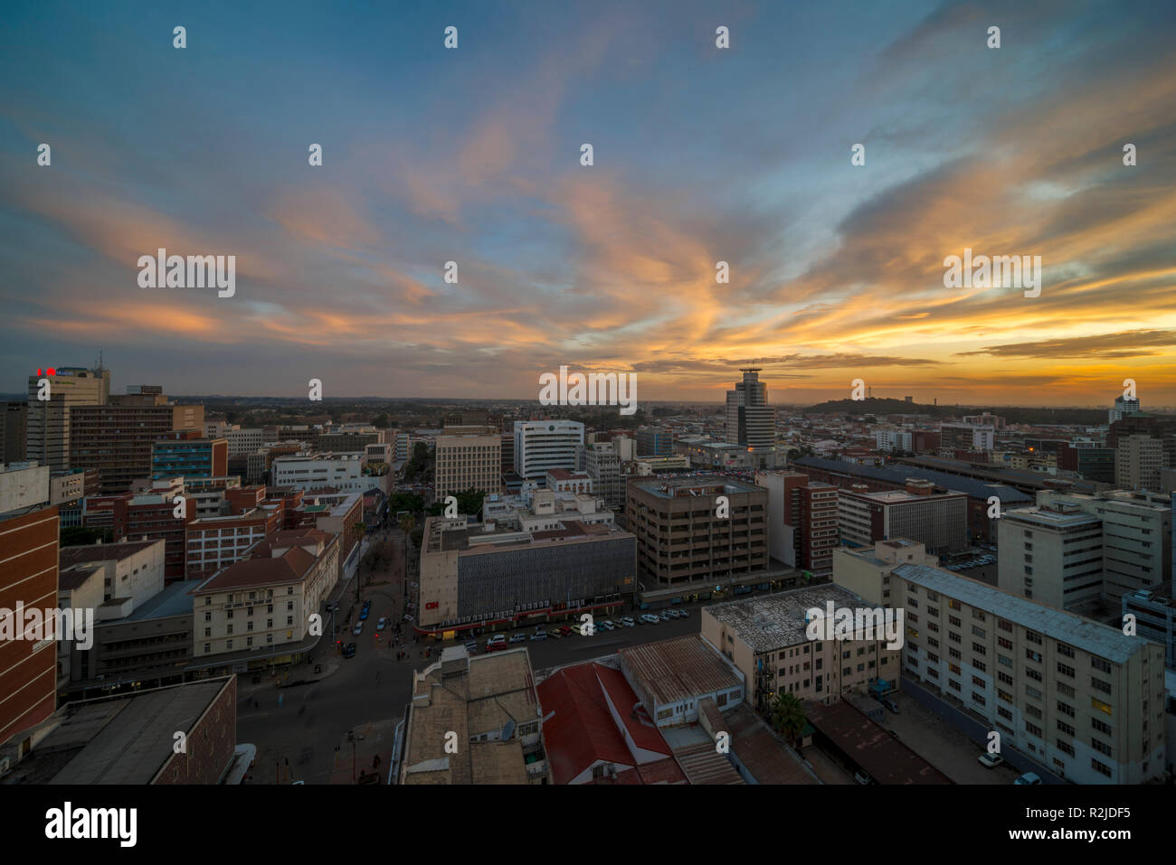 A sunset is seen over the Harare city skyline in Zimbabwe Stock Photo ...