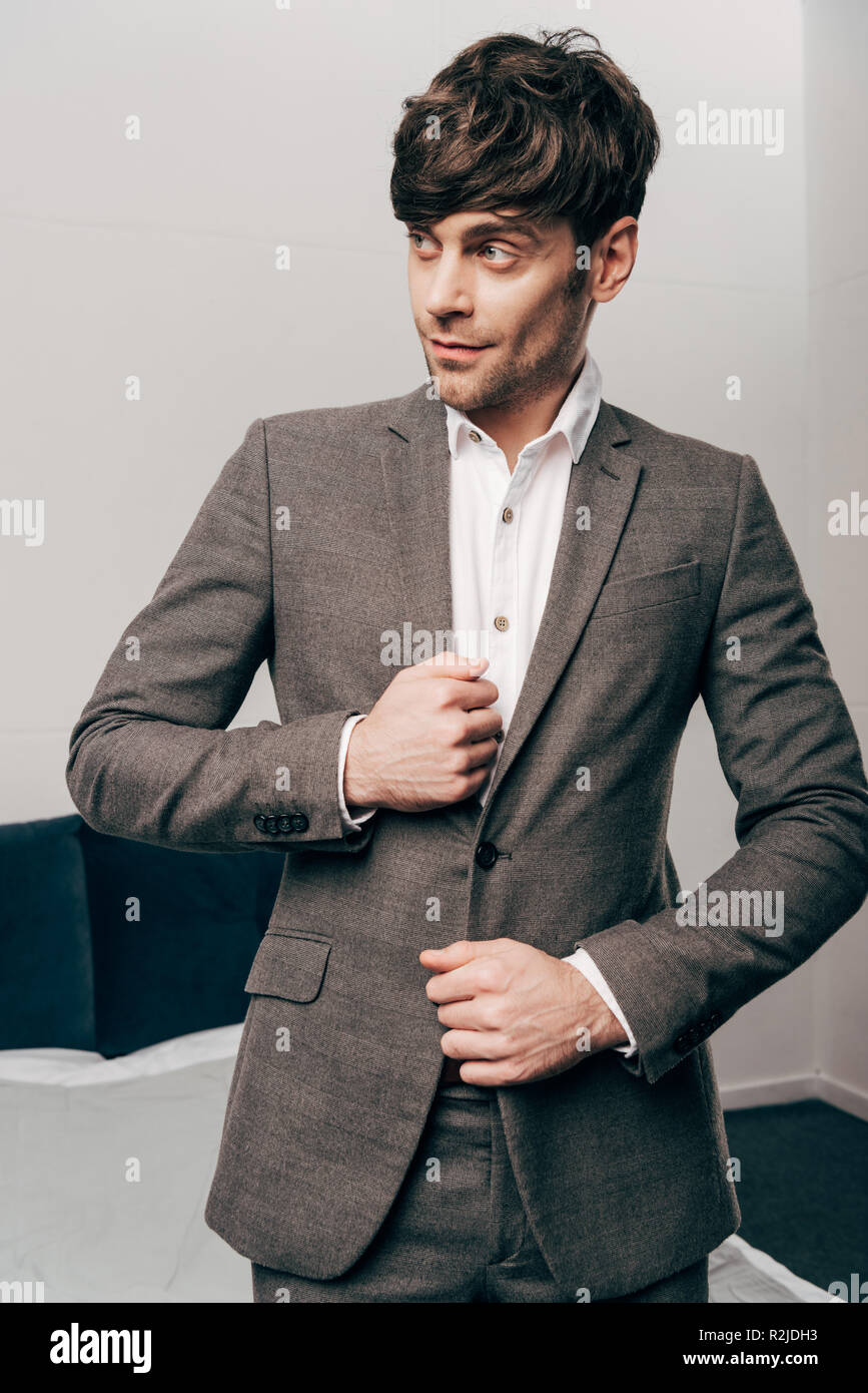 Putting on jacket hi-res stock photography and images - Alamy