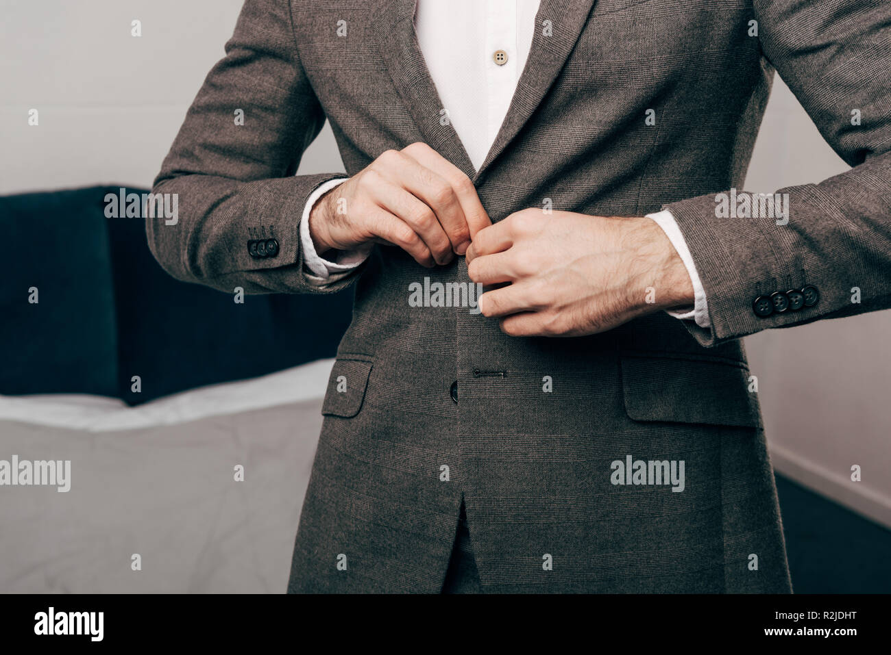 Businessman buttoning jacket hi-res stock photography and images - Alamy