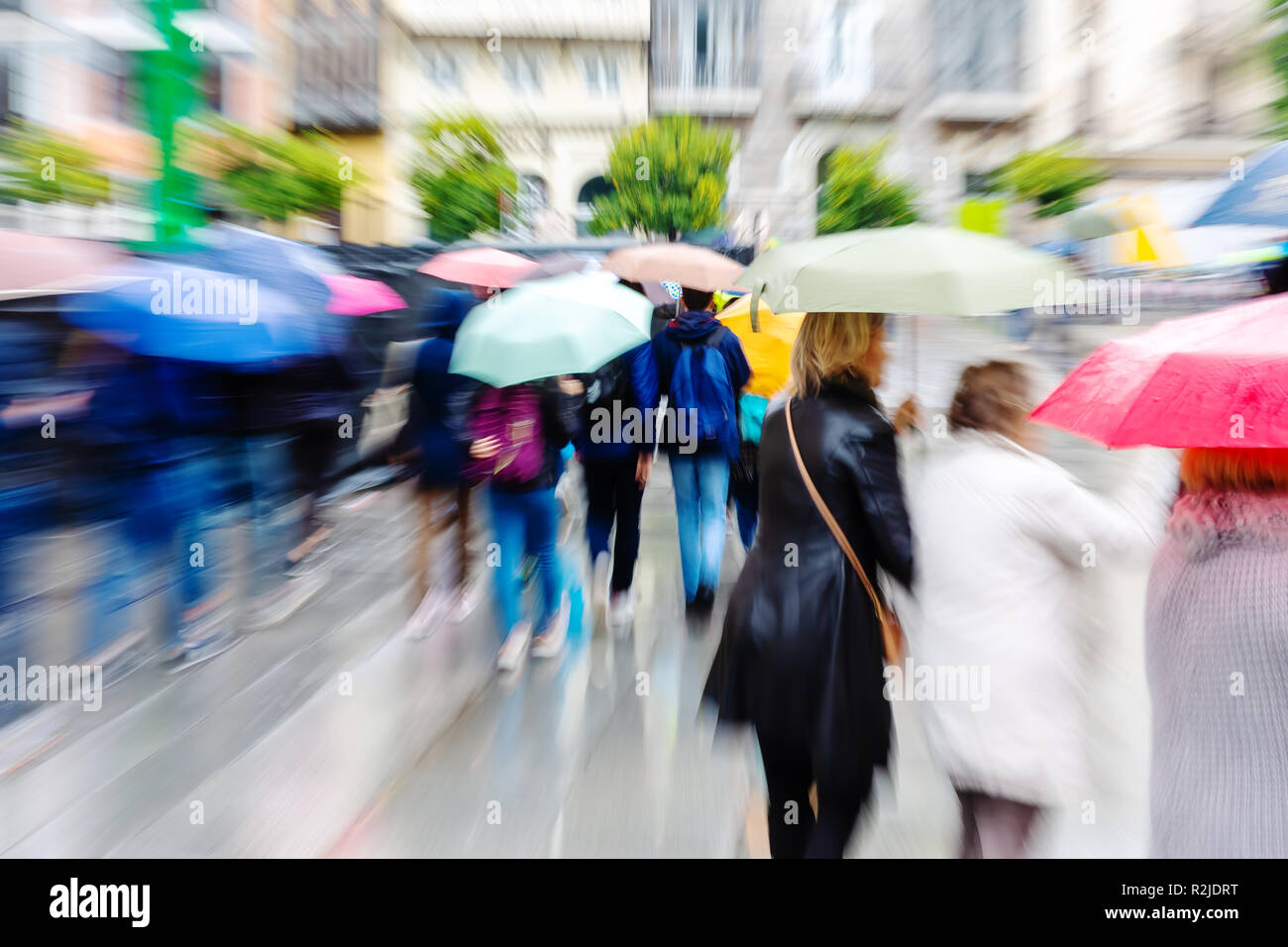 picture of a crowd of people walking in the rainy city with camera made ...