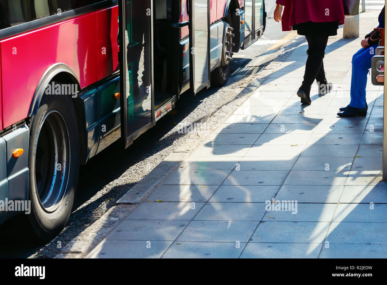 picture of a street scene at a bus station Stock Photo - Alamy
