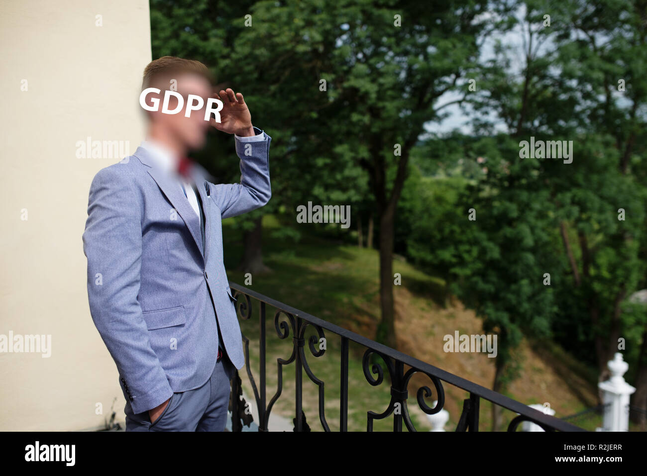 gdpr, man in the suit stands on the balcony and looks in the distance ...