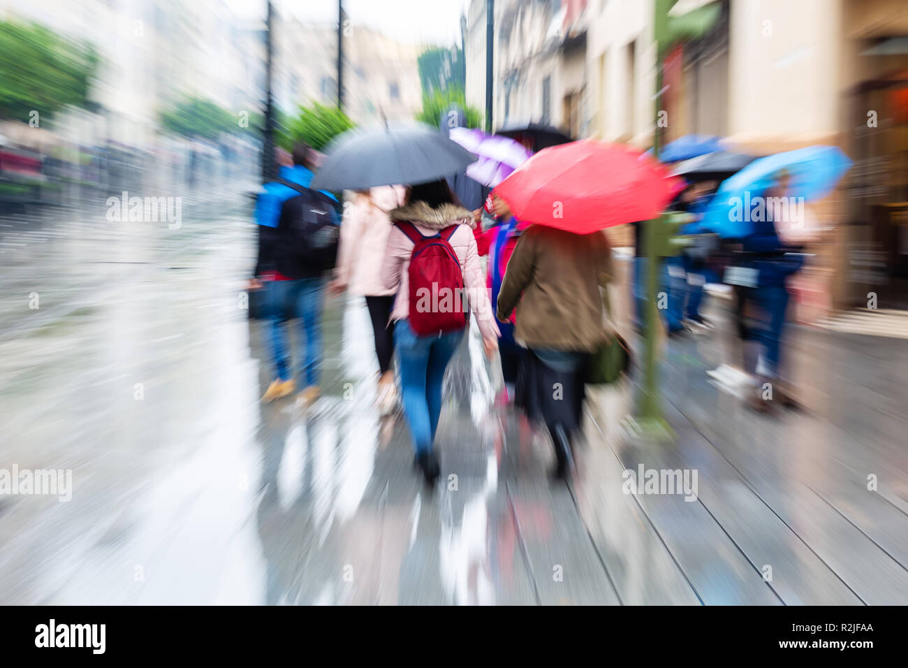 picture of a crowd of people walking in the rainy city with camera made ...