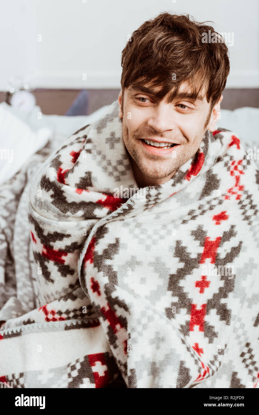 Sick male wrapped in blanket hi-res stock photography and images - Alamy