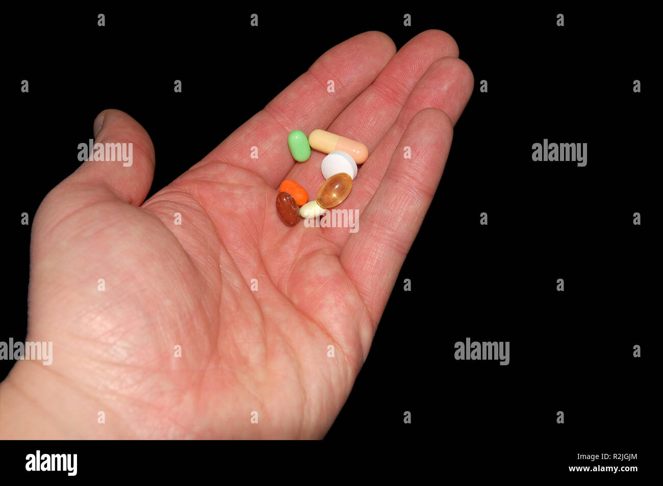 palm with pills Stock Photo - Alamy