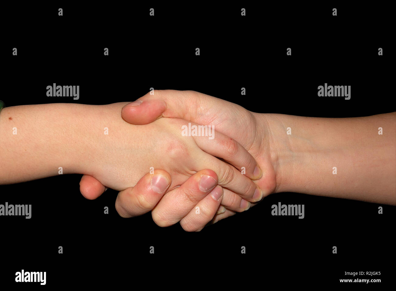 handshake isolated on black Stock Photo - Alamy