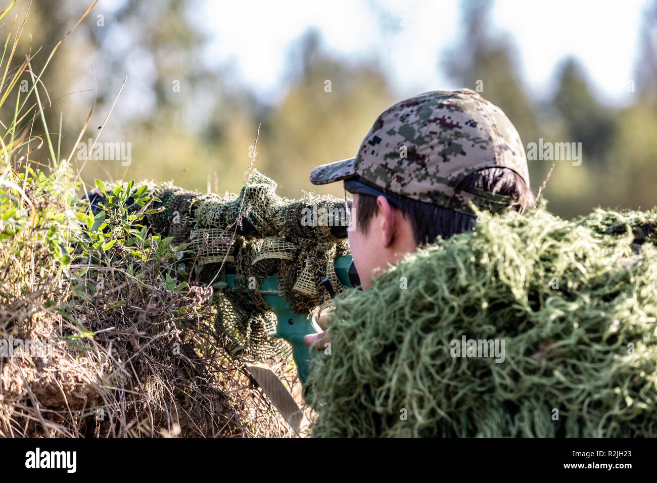 Sniper armed with large caliber, sniper rifle, shooting enemy targets ...