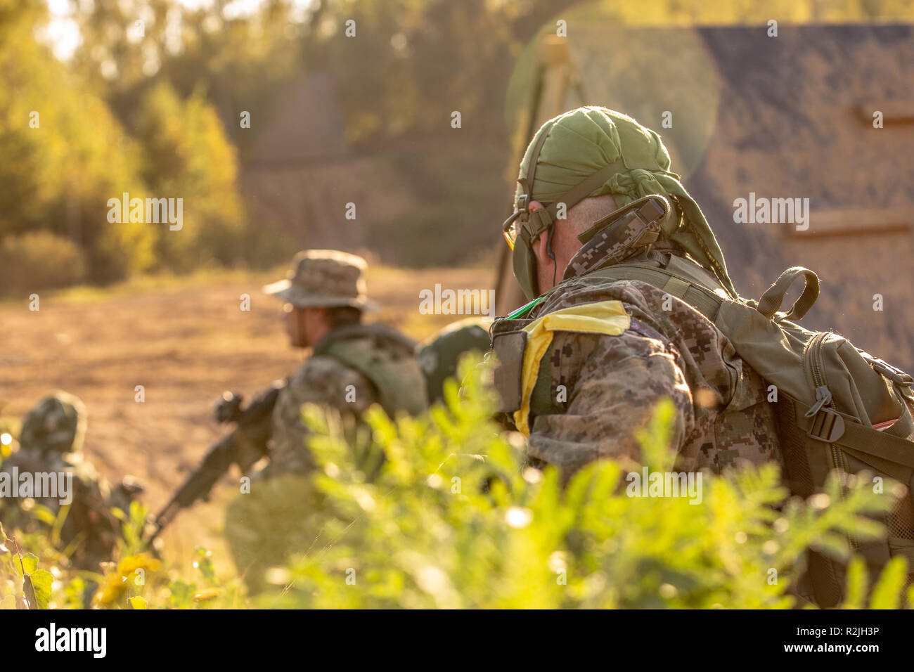 Sniper team armed with large caliber, sniper rifle, shooting enemy ...