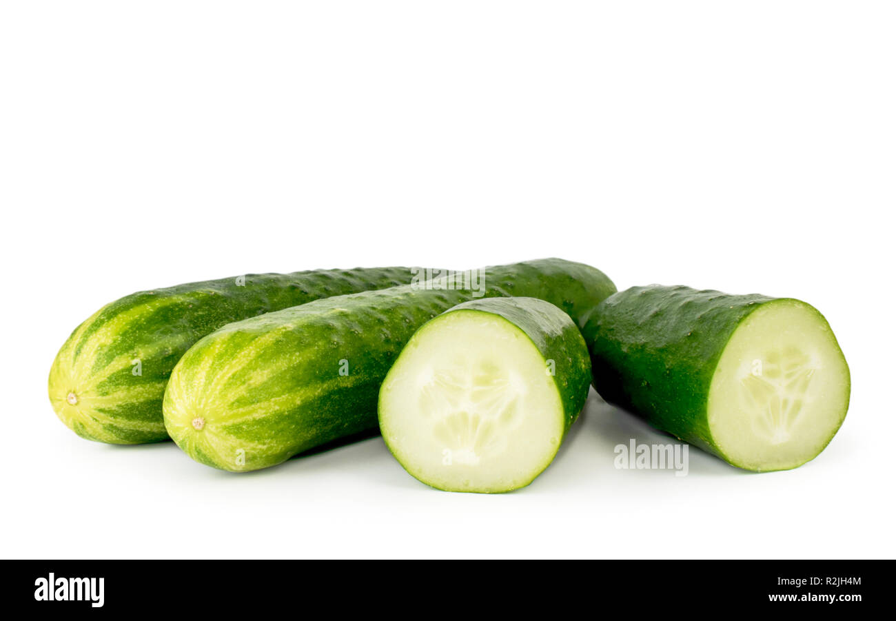 Whole cucumbers and half a cucumber. Isolated Stock Photo - Alamy