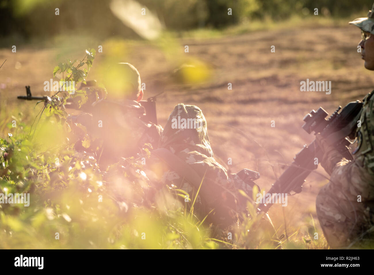 Sniper team armed with large caliber, sniper rifle, shooting enemy ...