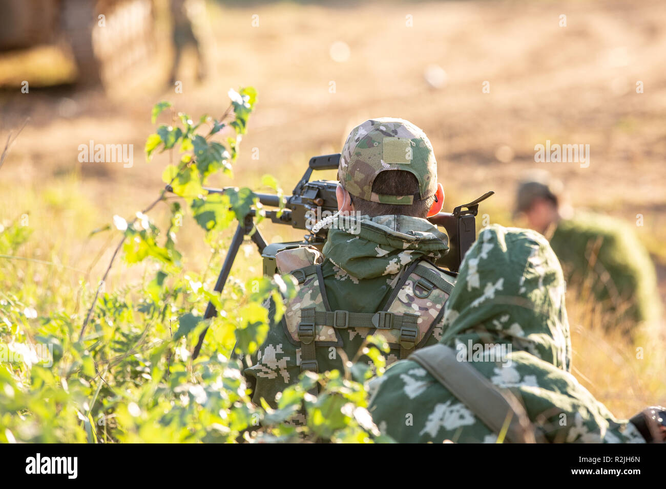 Sniper team armed with large caliber, sniper rifle, shooting enemy ...