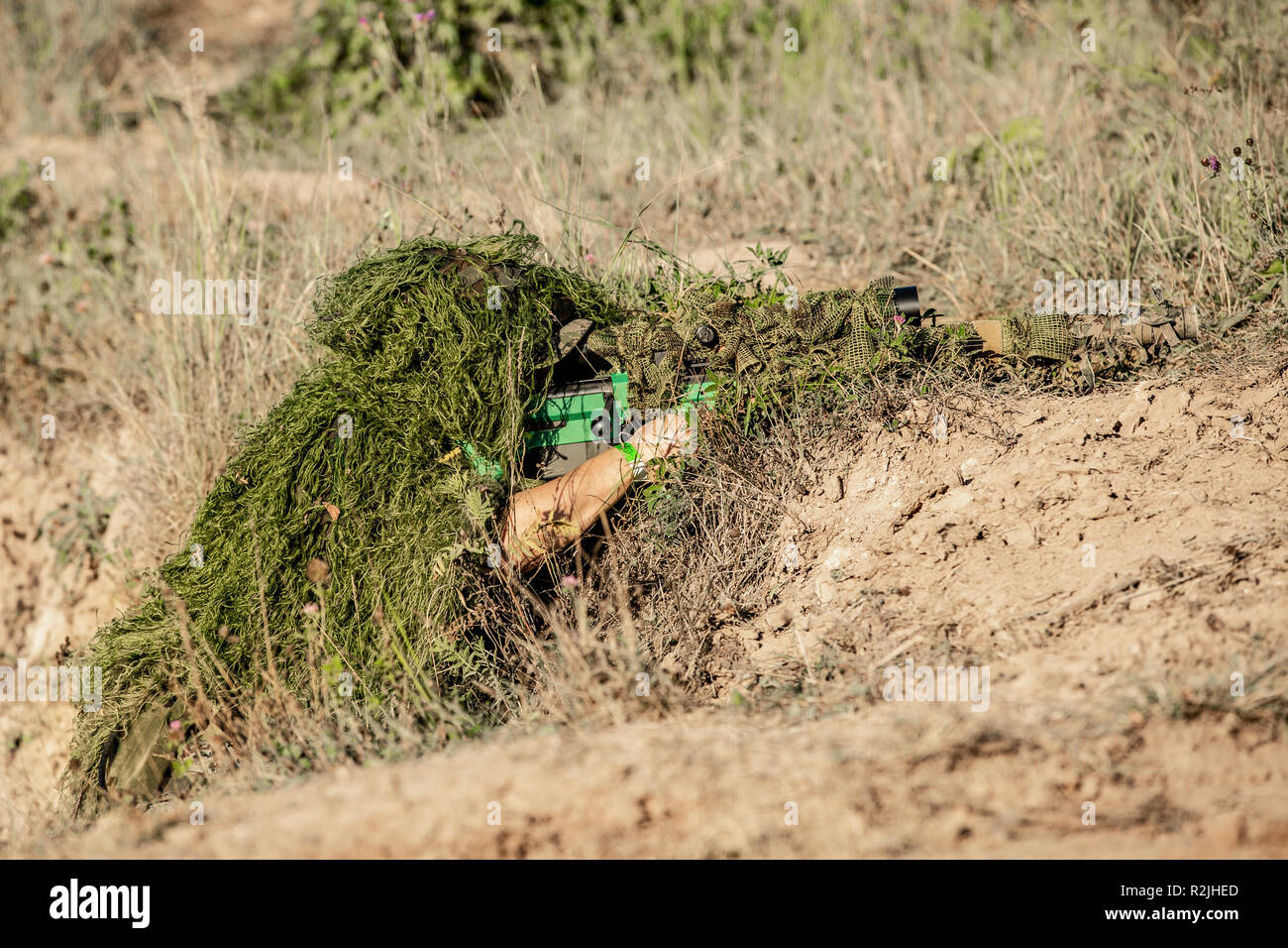 Sniper armed with large caliber, sniper rifle, shooting enemy targets ...