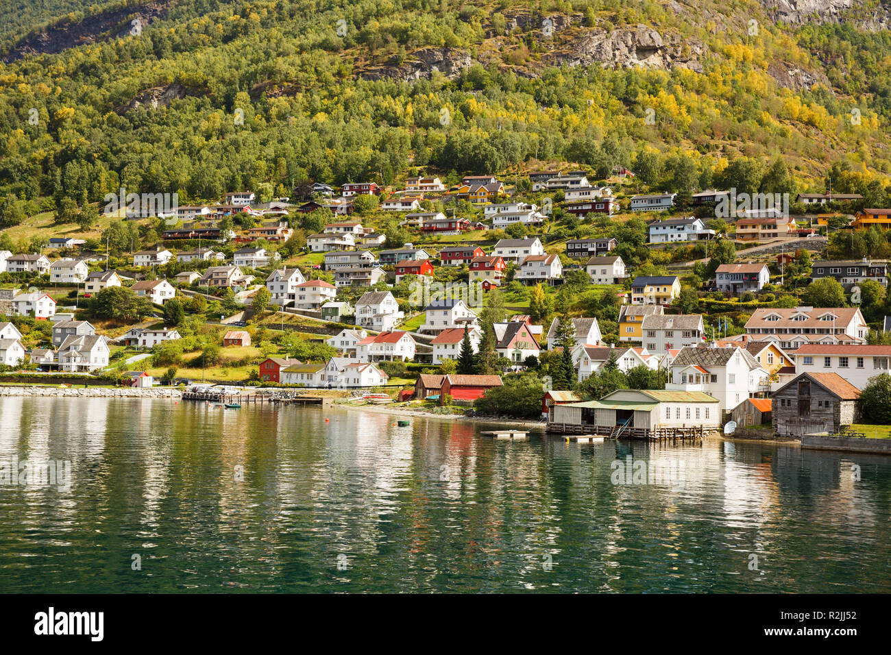Landscape with Naeroyfjord, mountains and traditional village houses in ...
