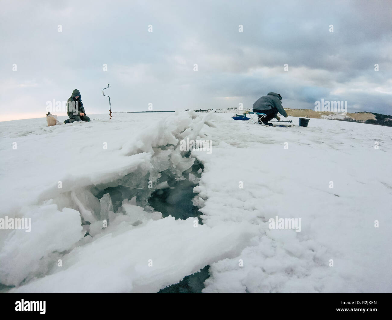 Fishermen on ice, Nida, Lithuania Stock Photo - Alamy