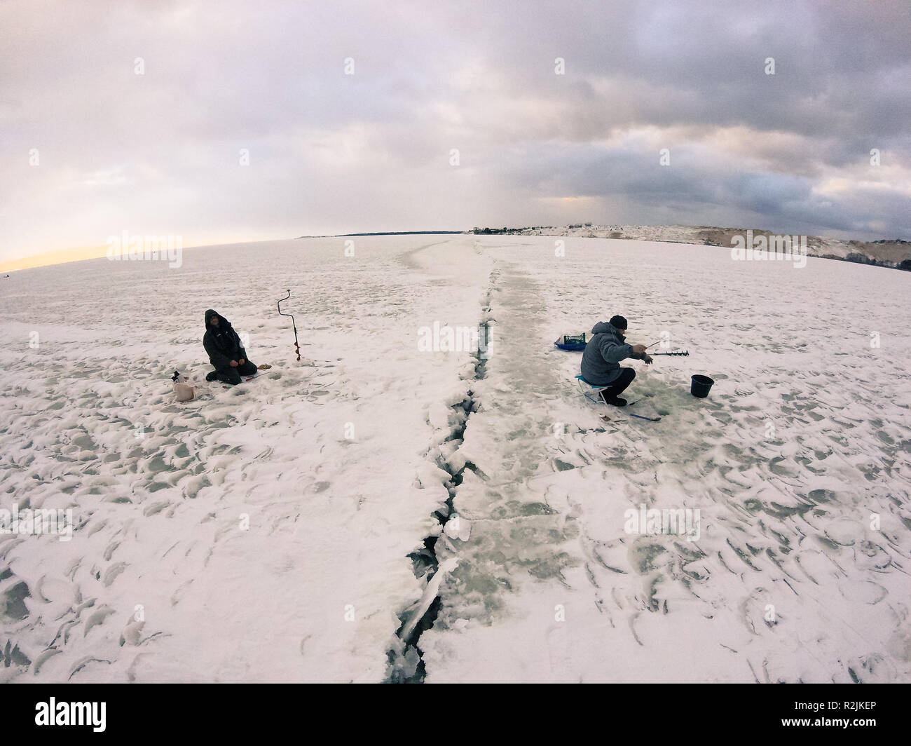 Fishermen on ice, Nida, Lithuania Stock Photo - Alamy