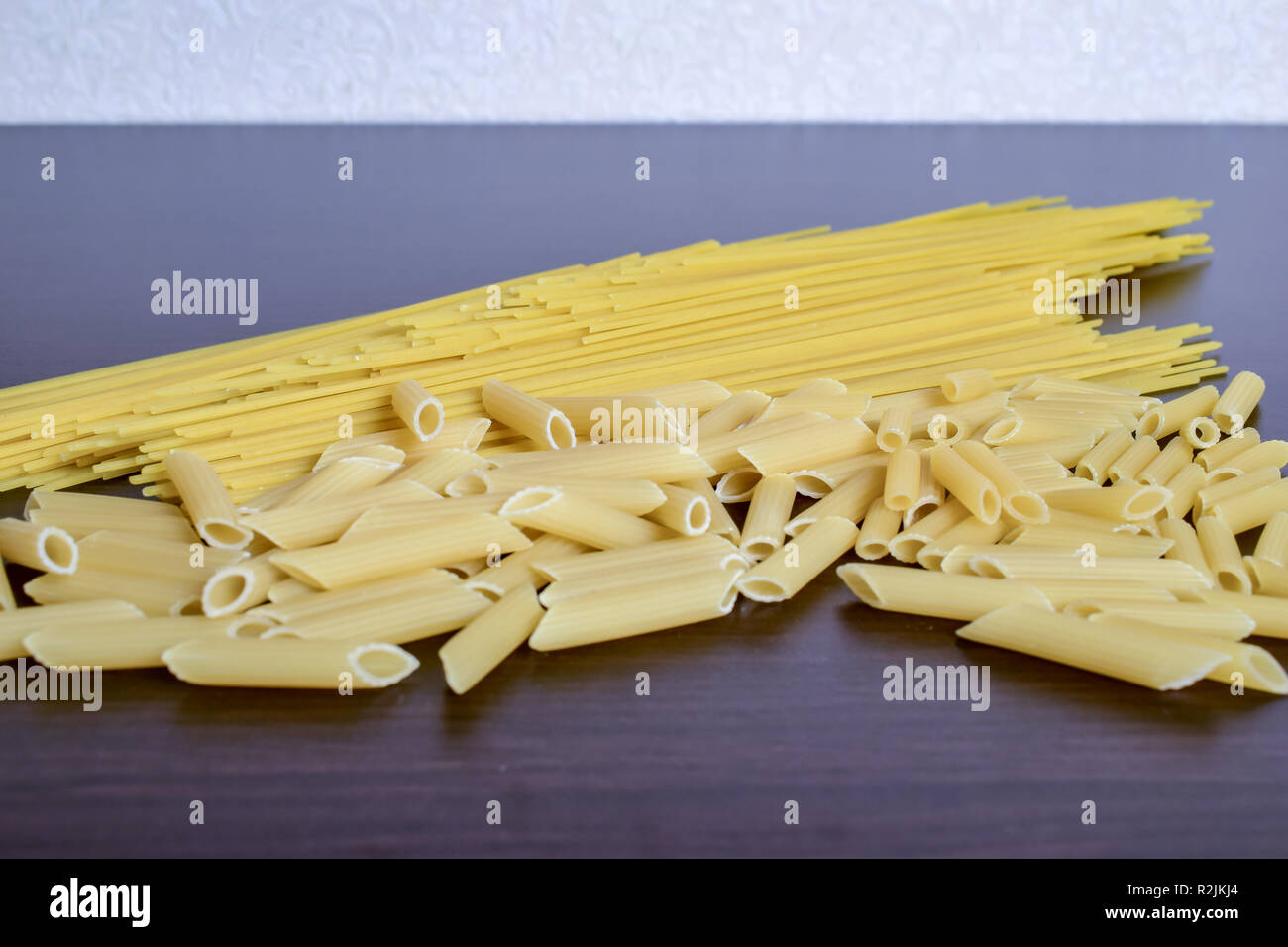 Mixed dried pasta selection on wooden background tasty product Stock ...