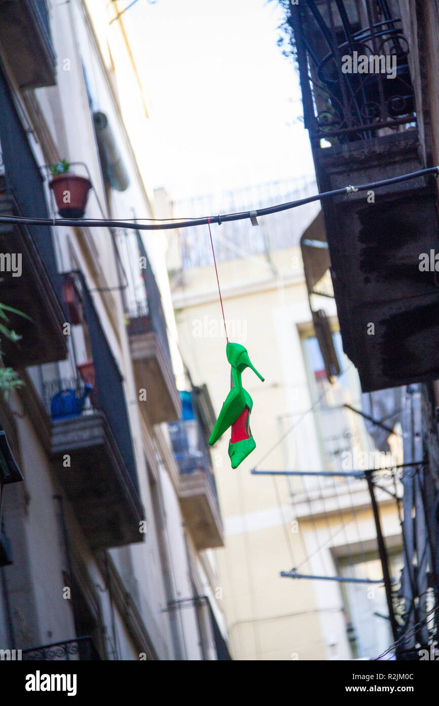 Shoes hanging from telephone wire Stock Photo - Alamy