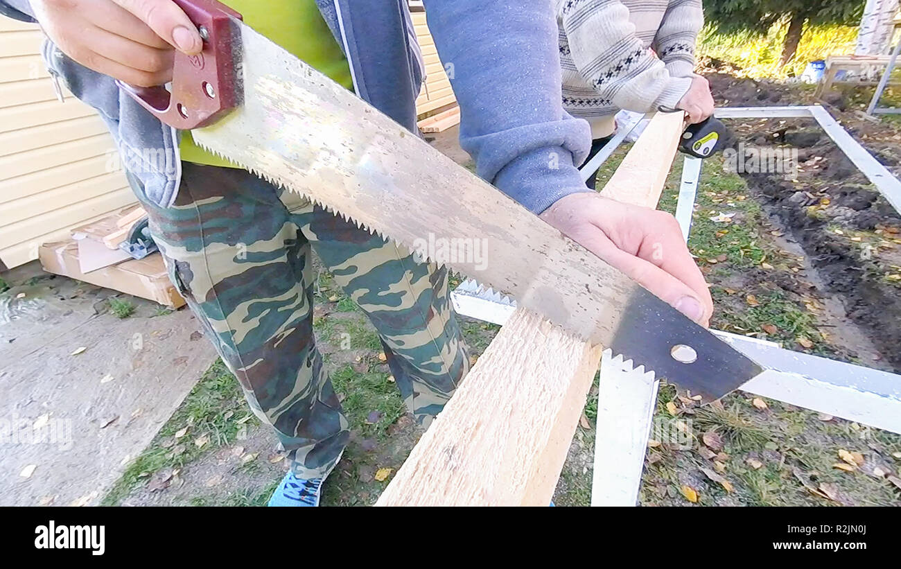 Saw cut part of the wooden bar on the street Stock Photo - Alamy