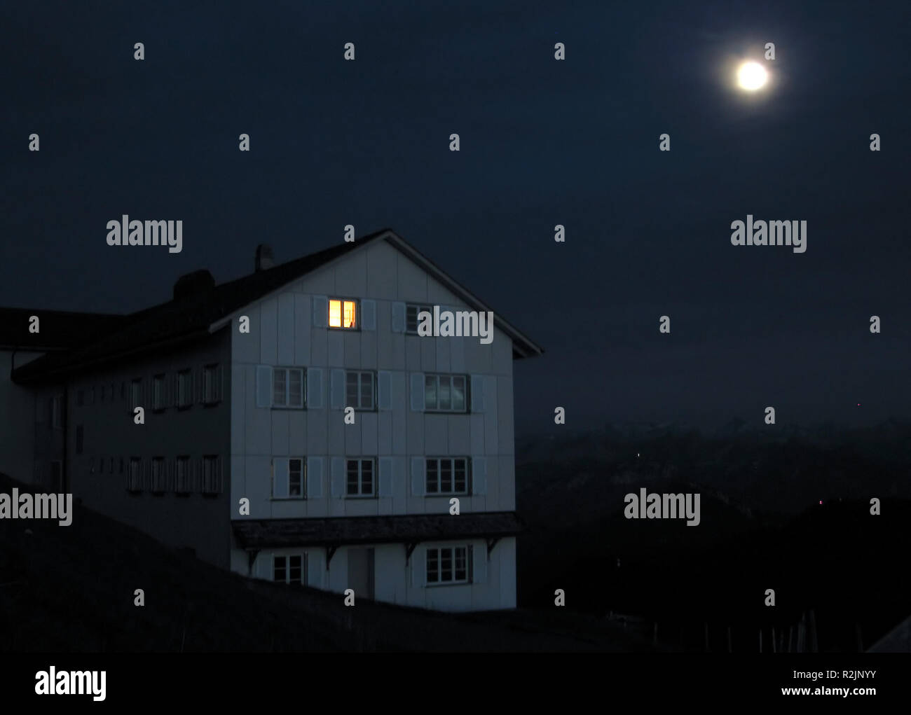 house at full moon with bright window Stock Photo - Alamy