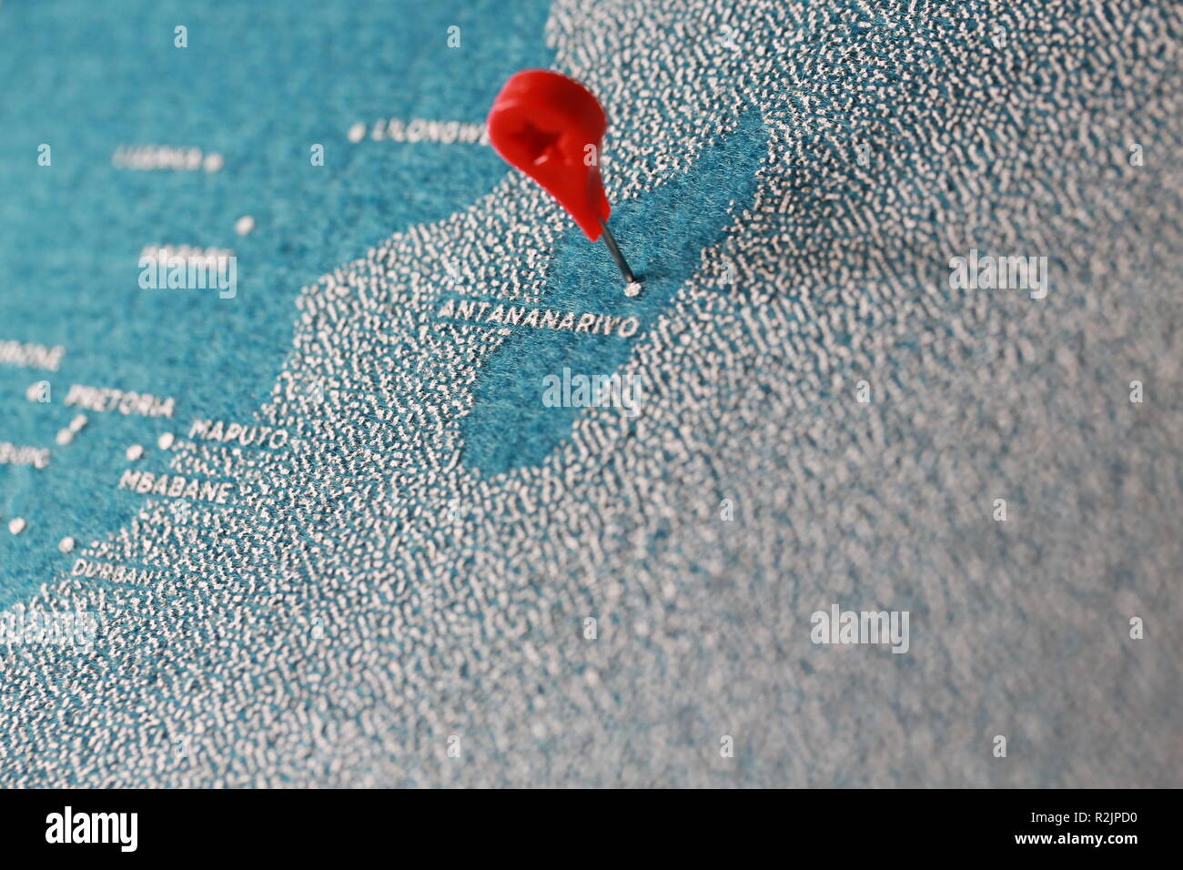 plane fly on painted map (macro photography Stock Photo - Alamy