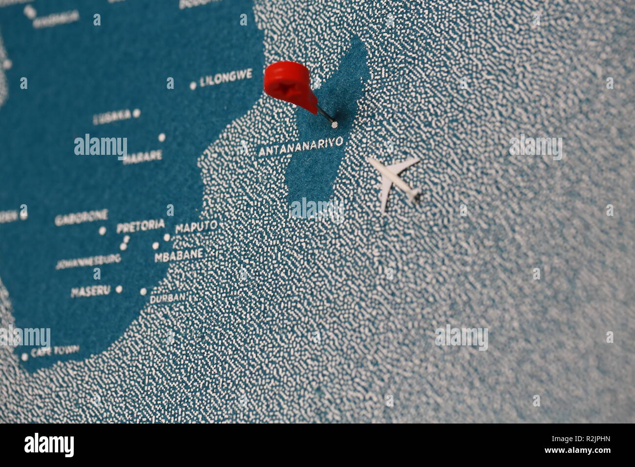 plane fly on painted map (macro photography Stock Photo - Alamy