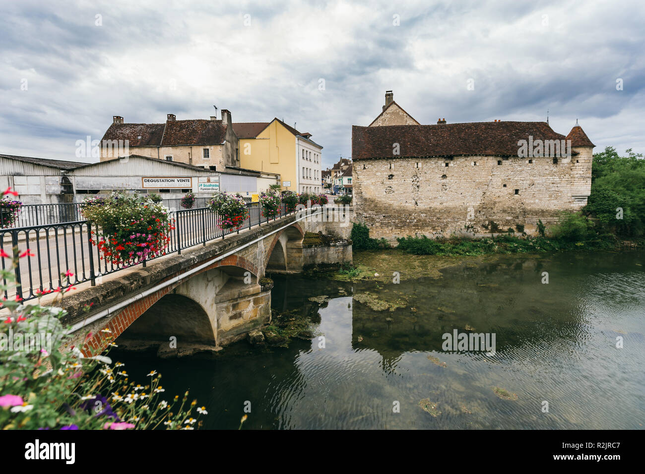 landscape of a medieval French town, over a lake stone bridge with ...