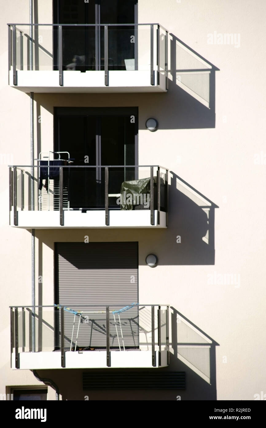 New and modern balconies of an apartment building cast shadows Stock ...