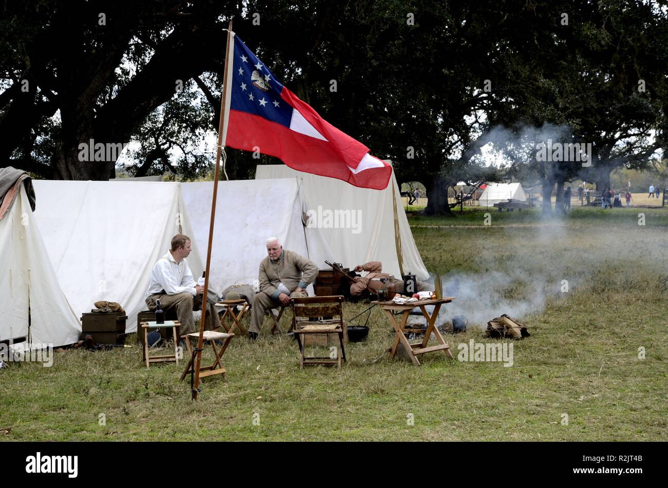 American Civil War reenactment; Union camp with soldiers resting by ...