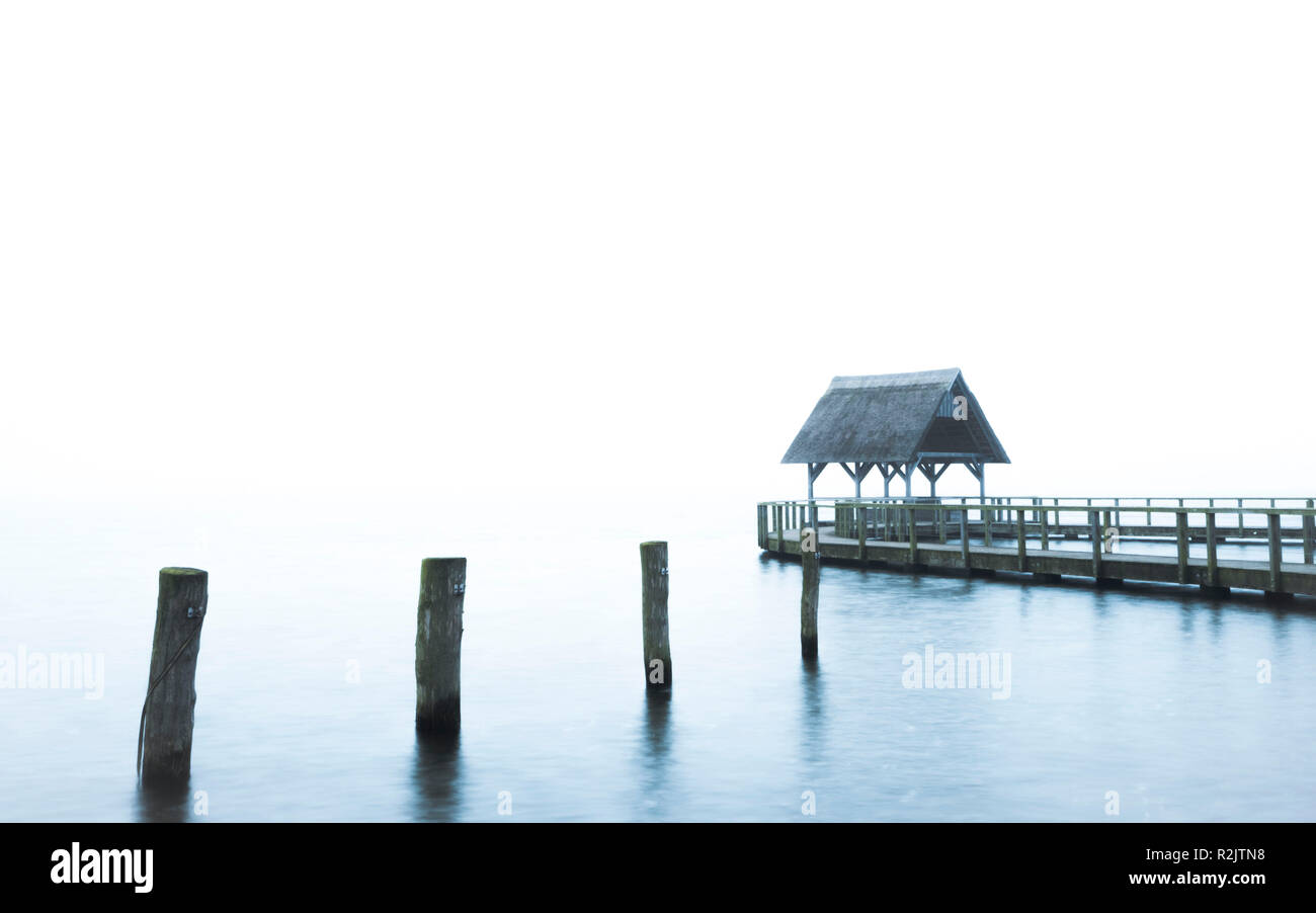 Jetty with thatched roof at the lake Stock Photo - Alamy