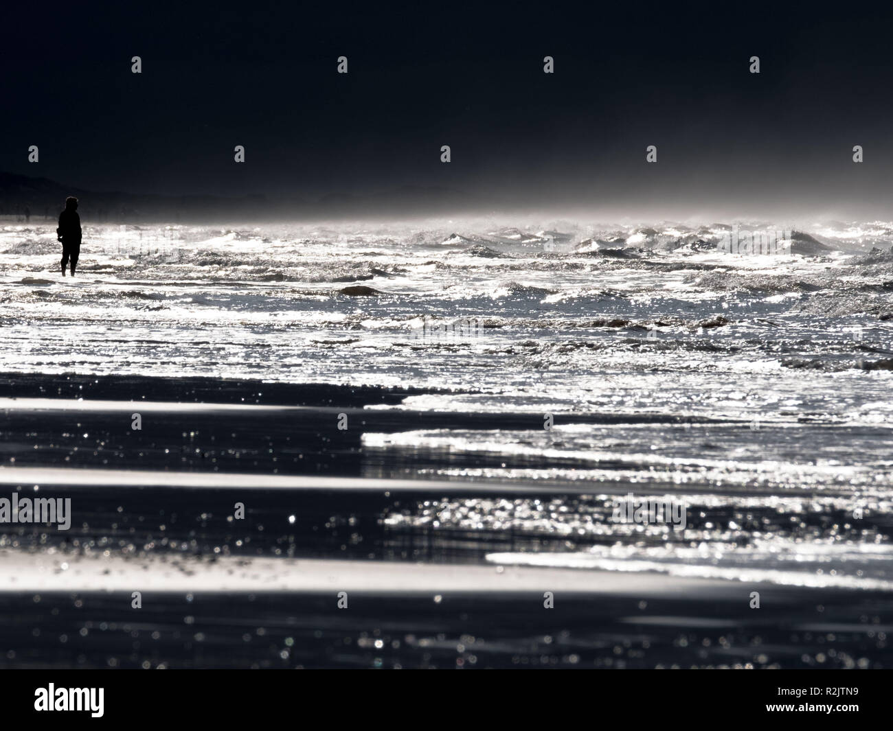 Person looking at the sea Stock Photo - Alamy
