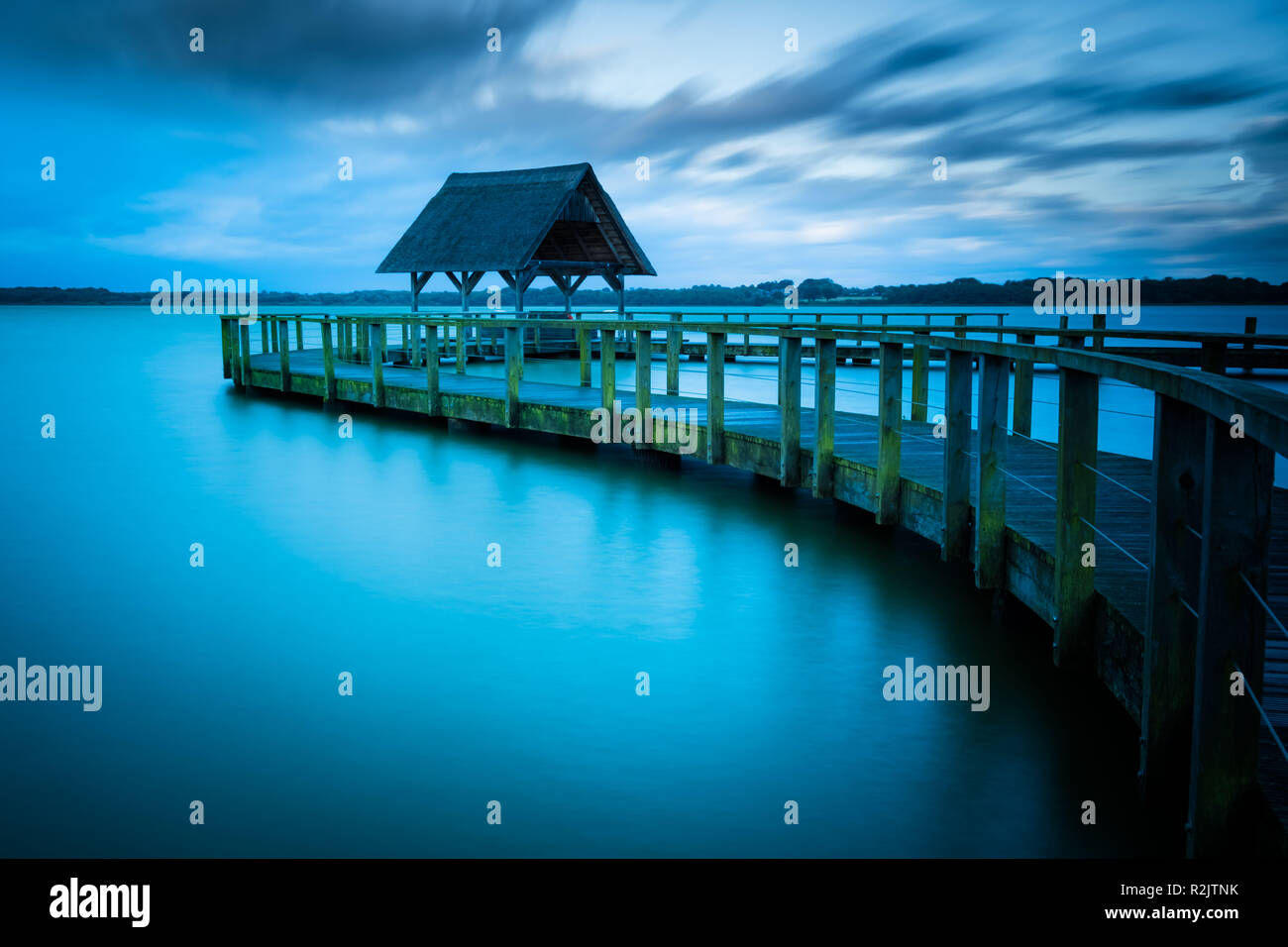 Jetty with thatched roof at the lake hi-res stock photography and ...