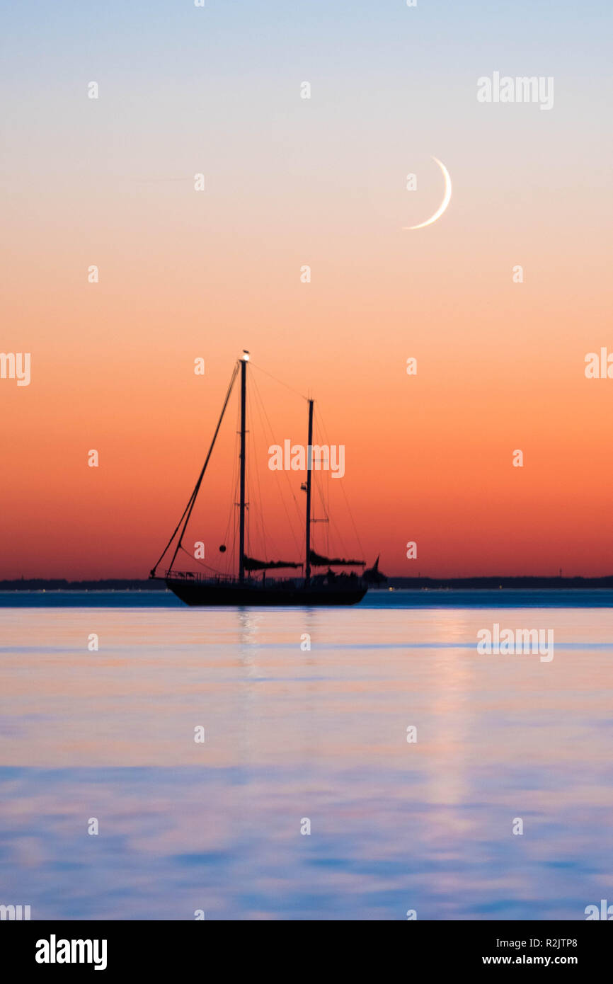 Crescent moon over Baltic Sea with two-master Stock Photo - Alamy