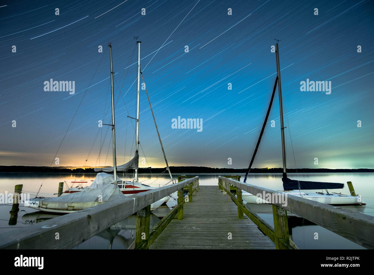 Jetty at night with star trails hi-res stock photography and images - Alamy
