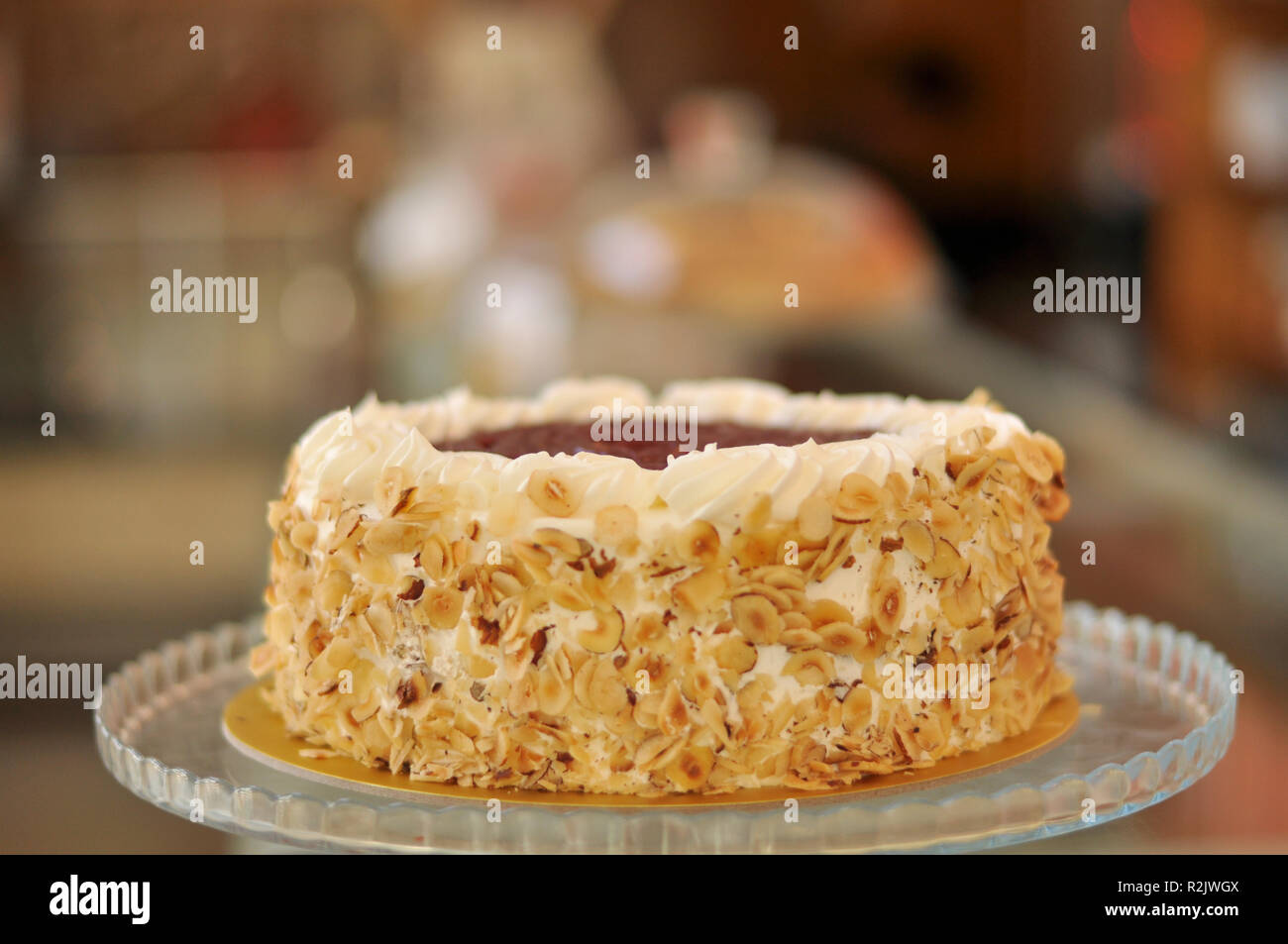 Delicious raspberry hazelnut cake with raspberry dressing on top and ...