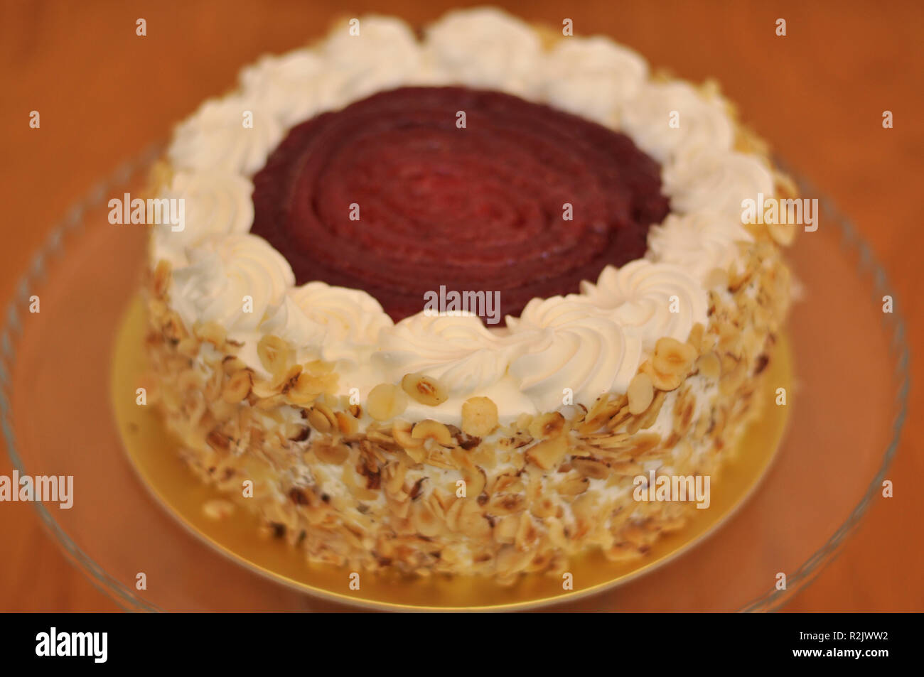 Delicious raspberry hazelnut cake with raspberry dressing on top and ...