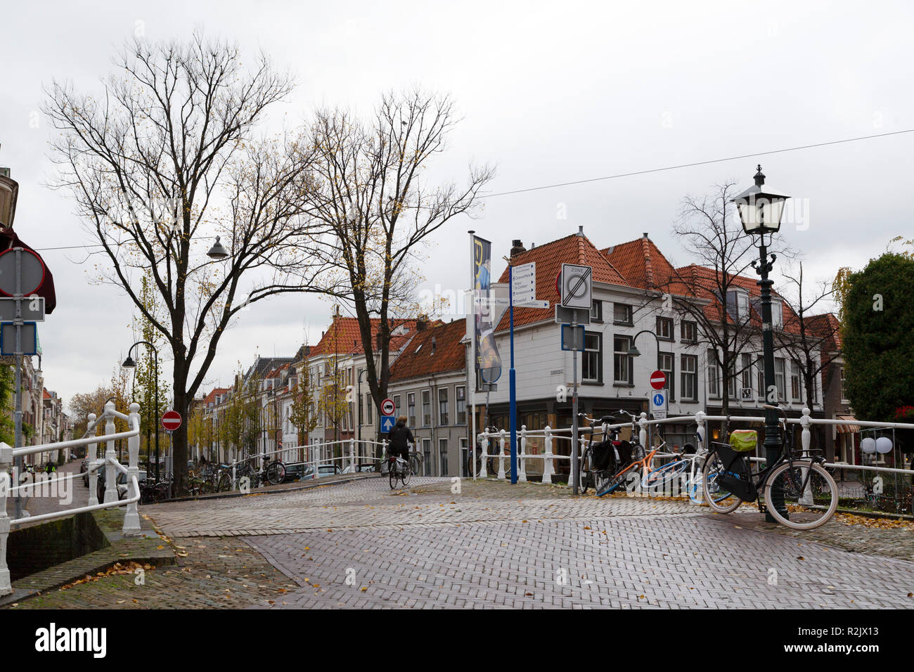 Traditional Dutch street in Delft, the Netherlands. The cobbled road ...