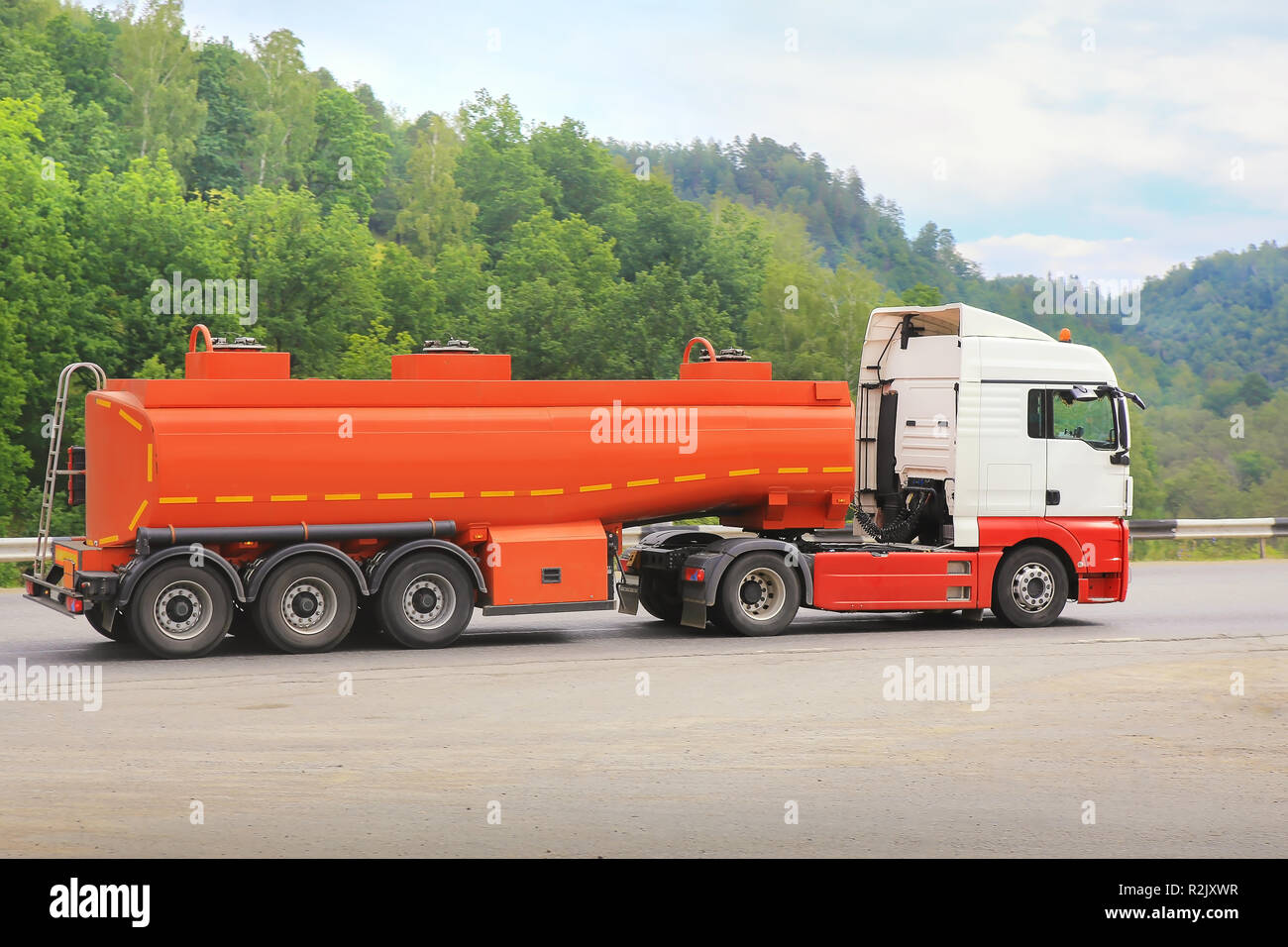 big gas-tank truck goes on highway Stock Photo - Alamy