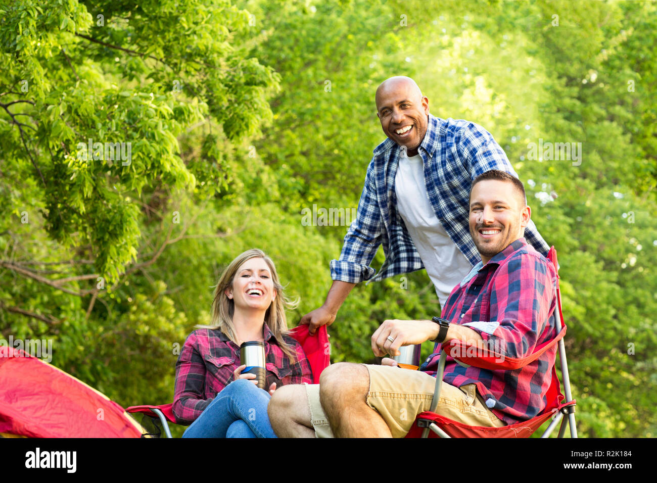 Multi-ethnic group of friends laughing and talking Stock Photo - Alamy