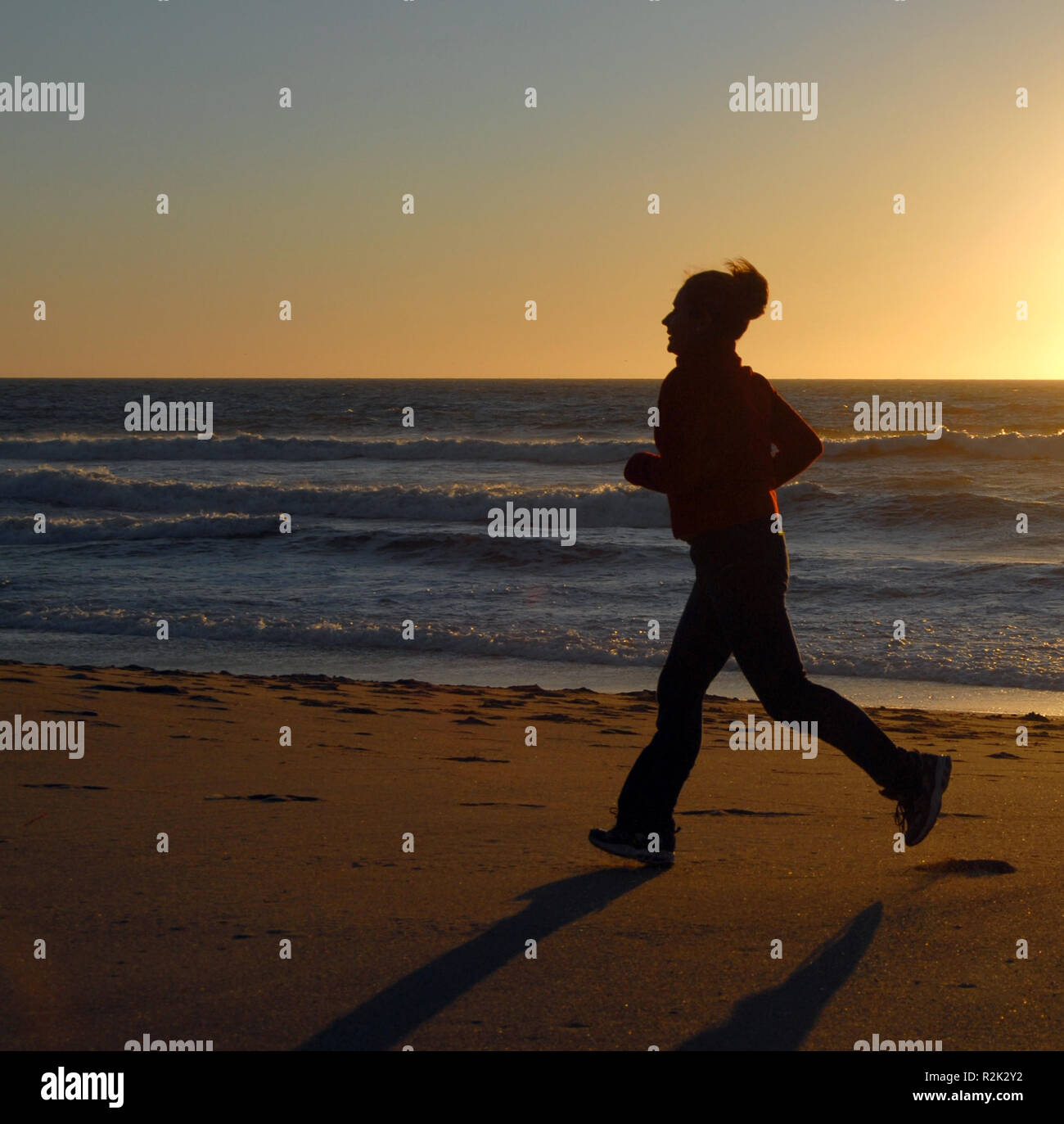 jogging on the beach Stock Photo - Alamy
