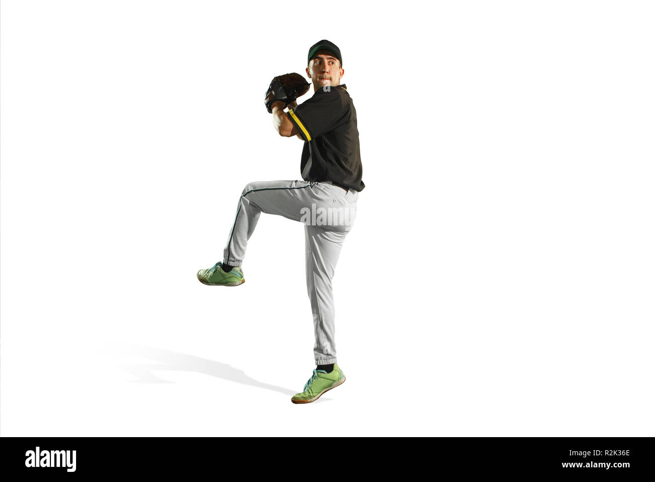 The fit caucasian man baseball player playing in studio. silhouette ...