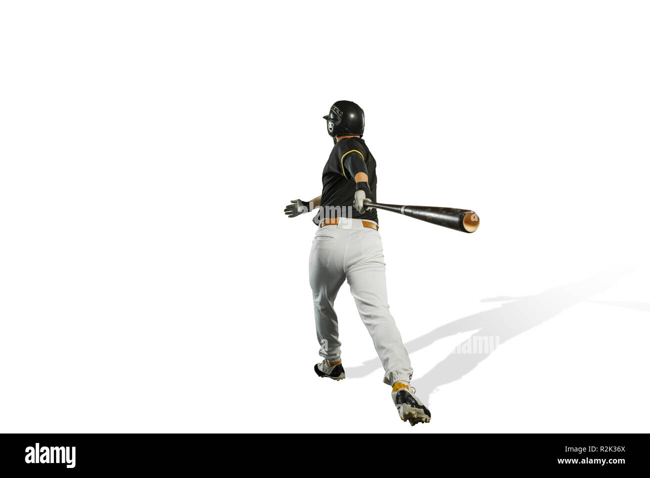 The fit caucasian man baseball player playing in studio. silhouette ...