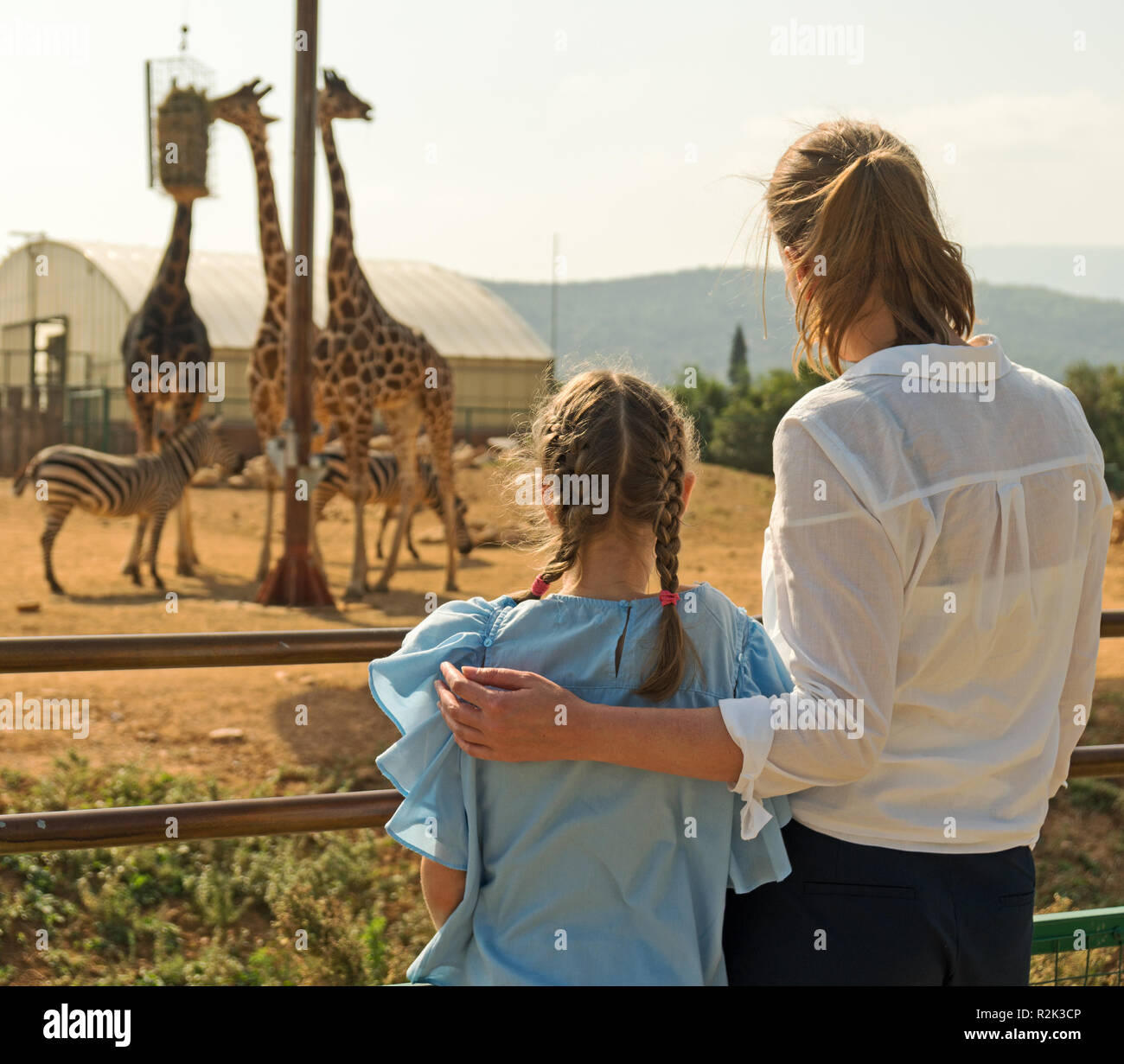 Woman and her daughter visiting zoo Stock Photo - Alamy