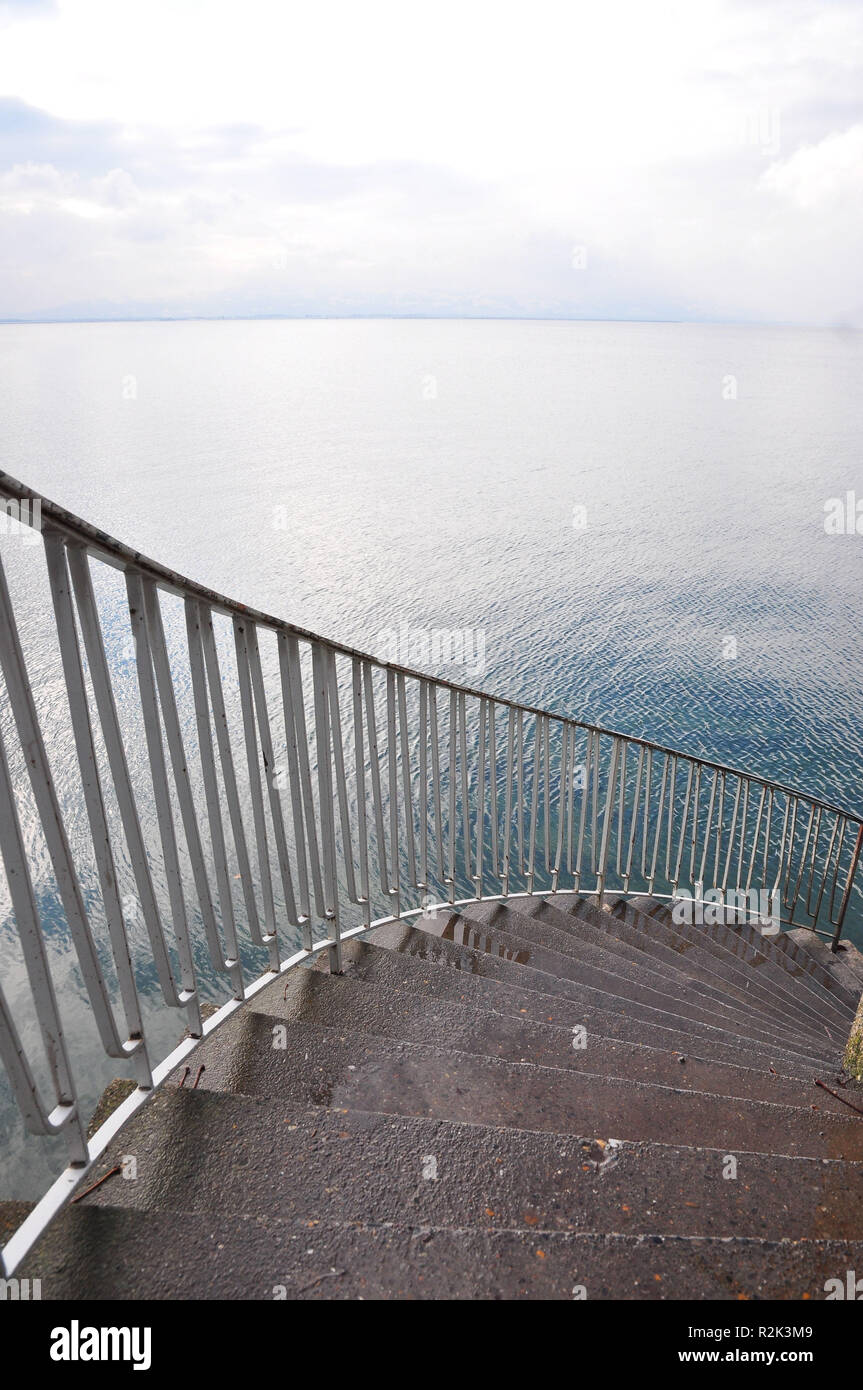 Stairs, railing, water surface Stock Photo - Alamy