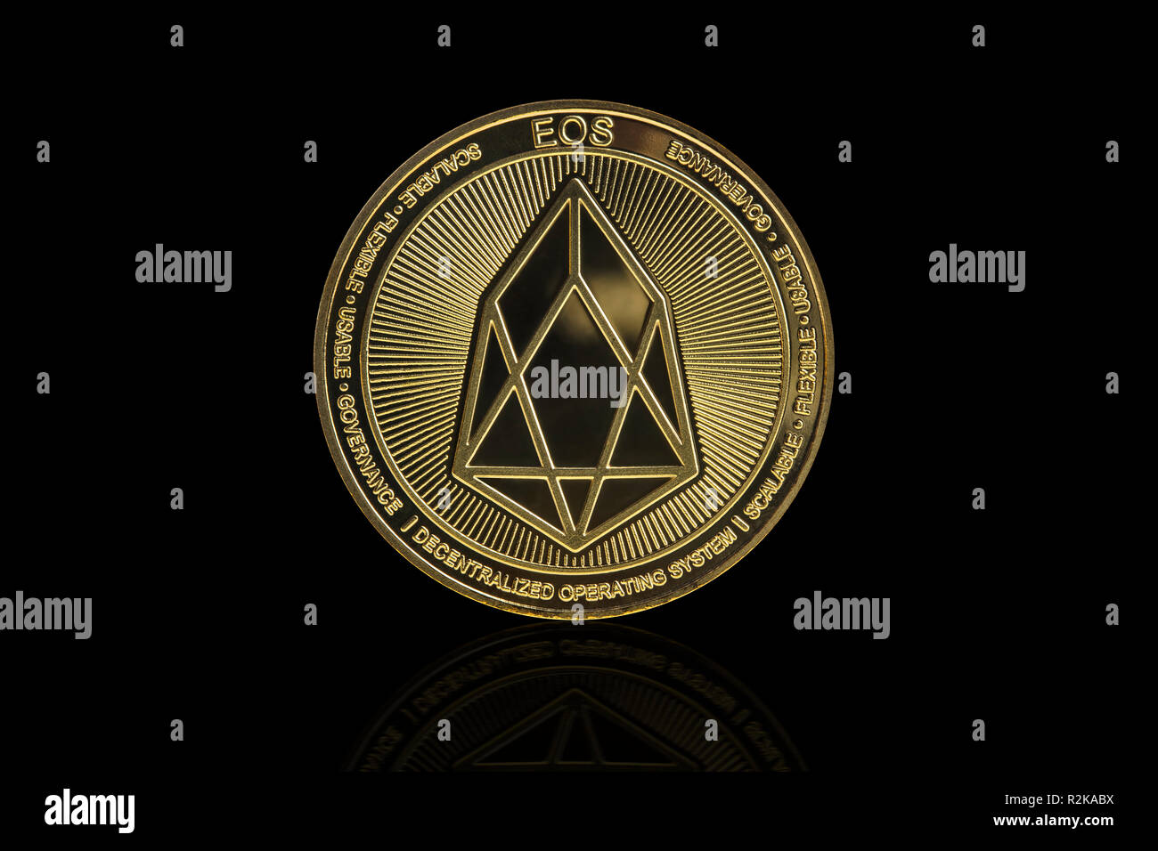 eos cryptocurrency coin on black background Stock Photo - Alamy